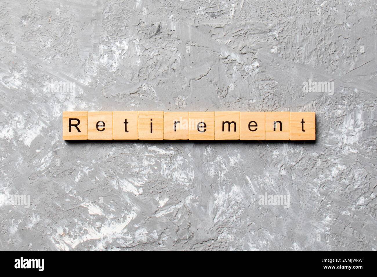 retirement word written on wood block. retirement text on cement table ...