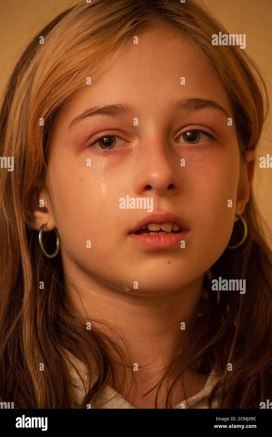 Portrait of little girl crying with tears rolling down her cheeks. Girl ...