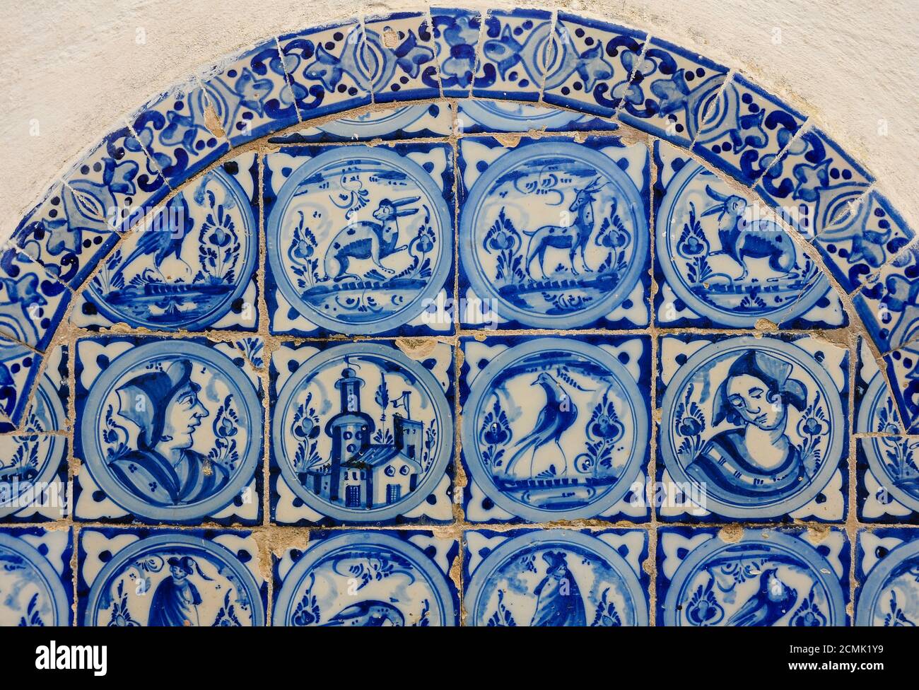Typical Andalusian azulejos (blue ceramic tiles) with animals and ...