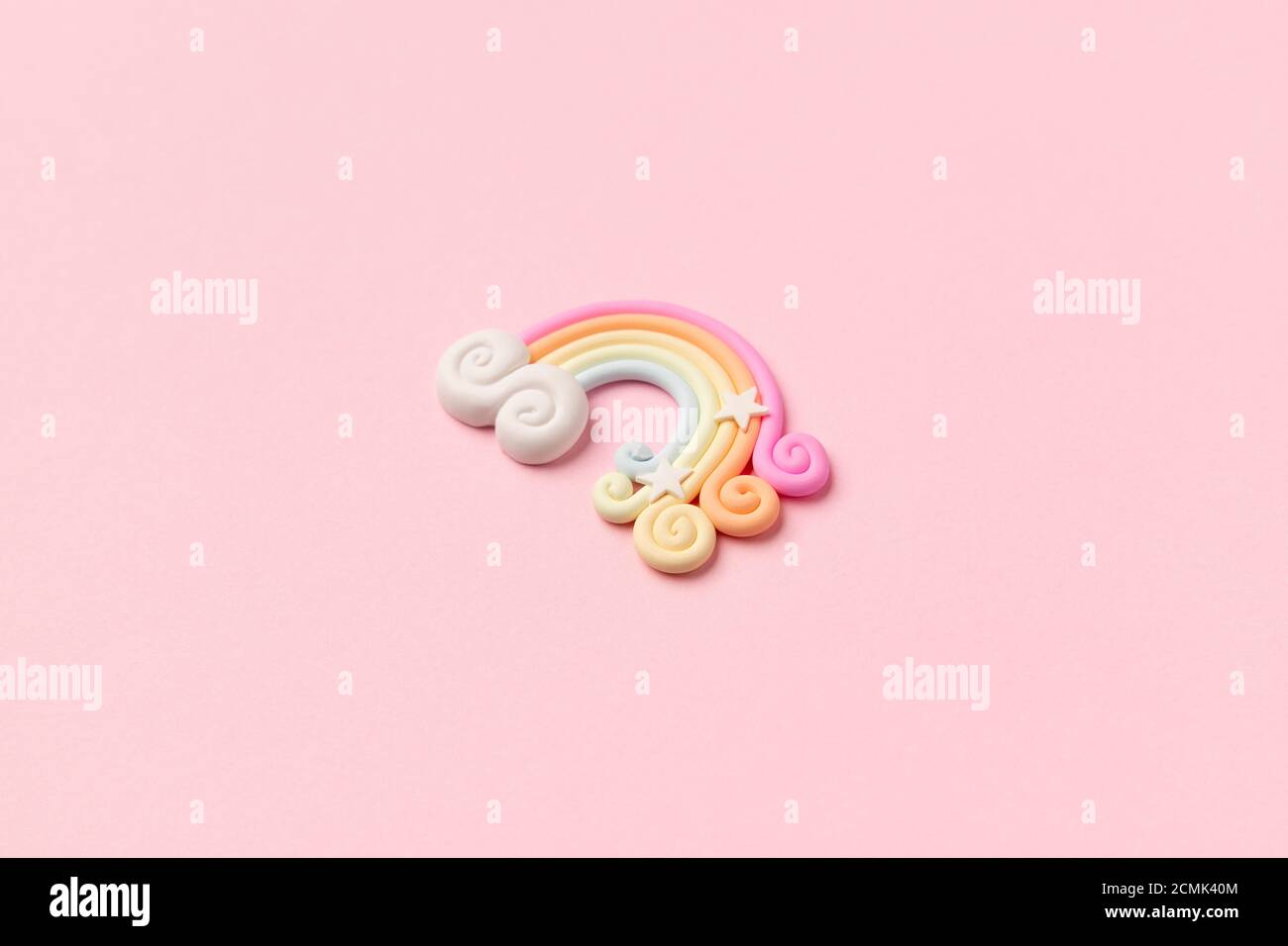 Rainbow pastel color arc on light pink background Stock Photo - Alamy