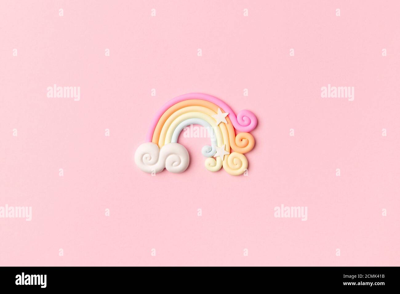 Rainbow pastel color arc on light pink background Stock Photo - Alamy