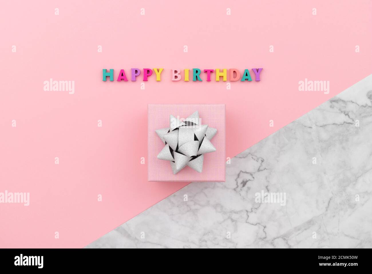 Happy birthday inscription from wooden colorful letters with gift box ...