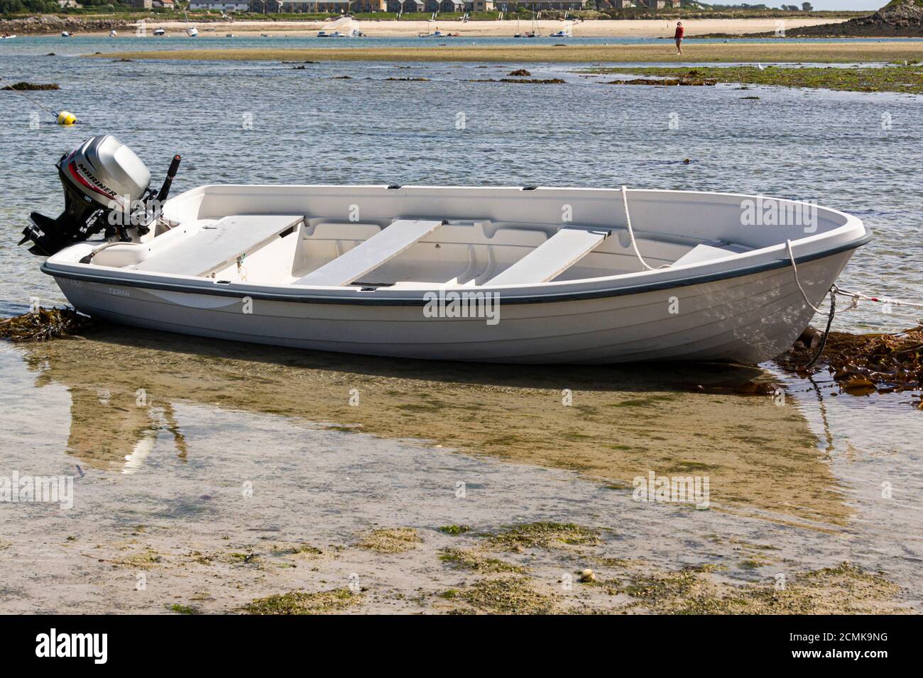 A boat stranded at extreme low tide Stock Photo - Alamy