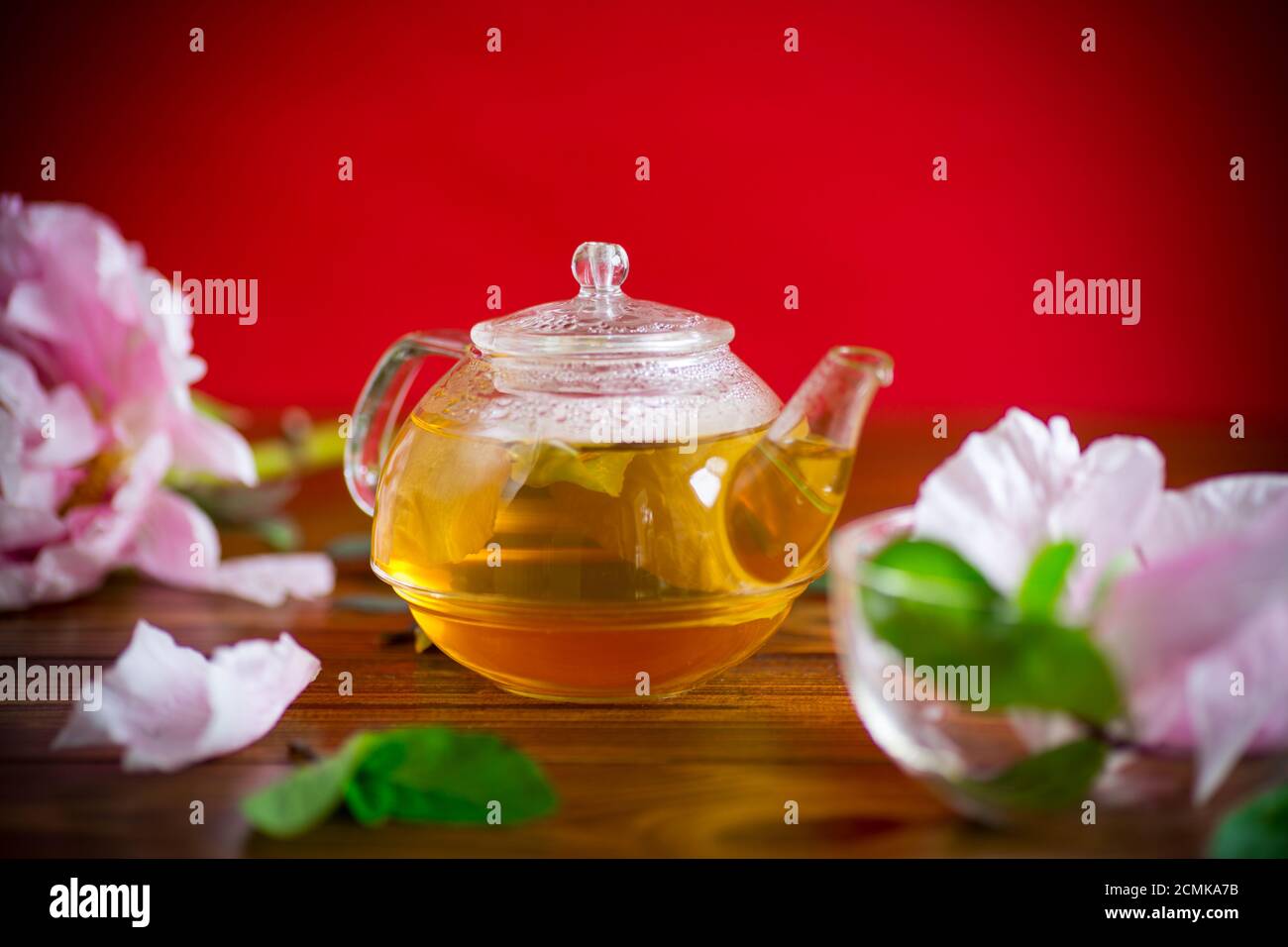 summer flower tea from rose petals in a glass teapot Stock Photo - Alamy