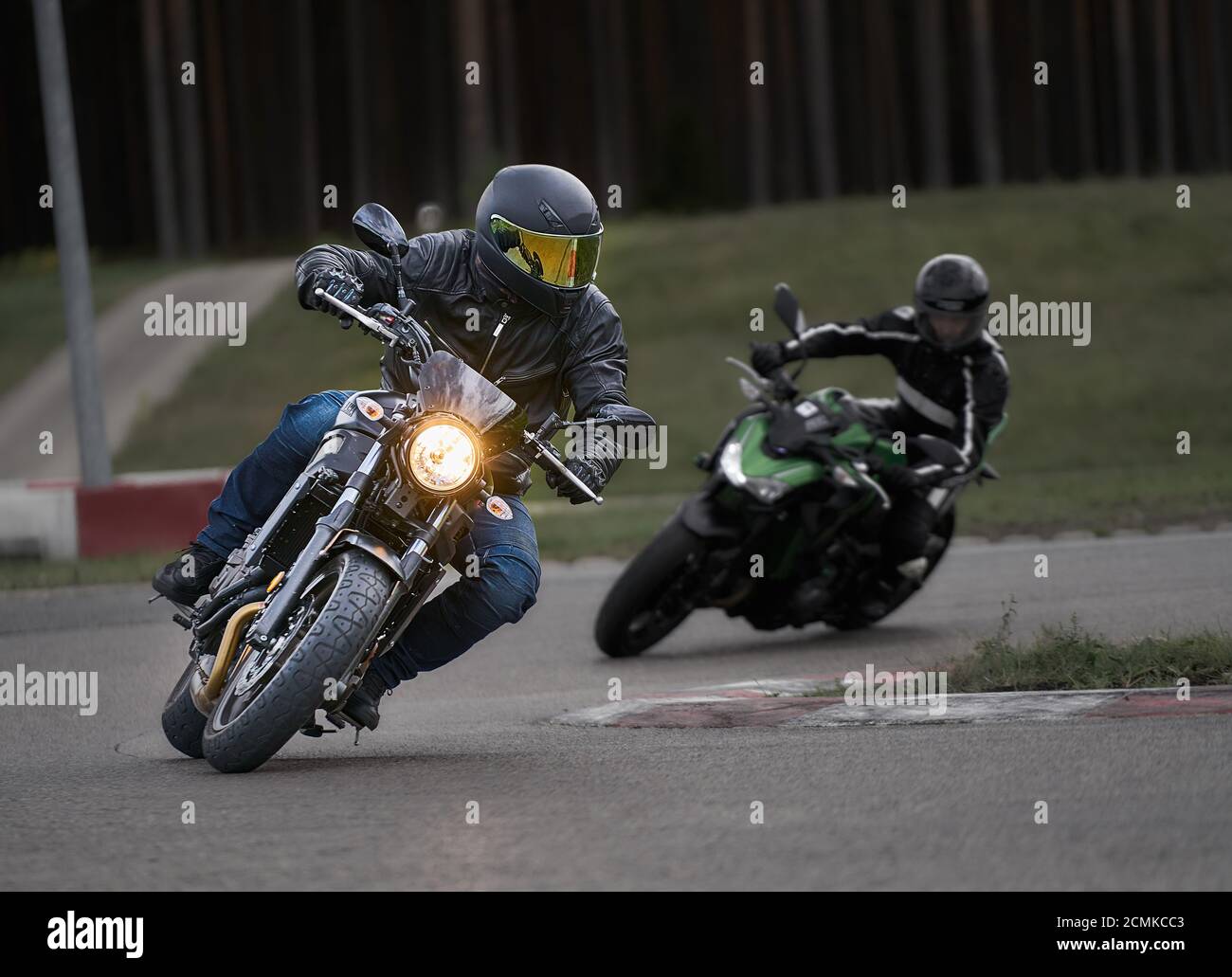 Handsome motorcyclist in black riding his super sport motorcycle Stock ...