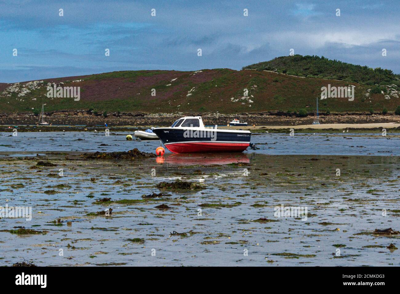 Boats stranded at extreme low tide in Green Bay, Bryher, Isles of ...