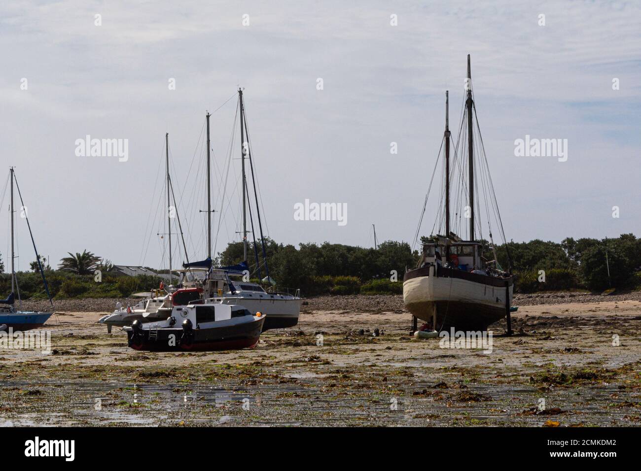 Boats stranded at extreme low tide in Green Bay, Bryher, Isles of ...