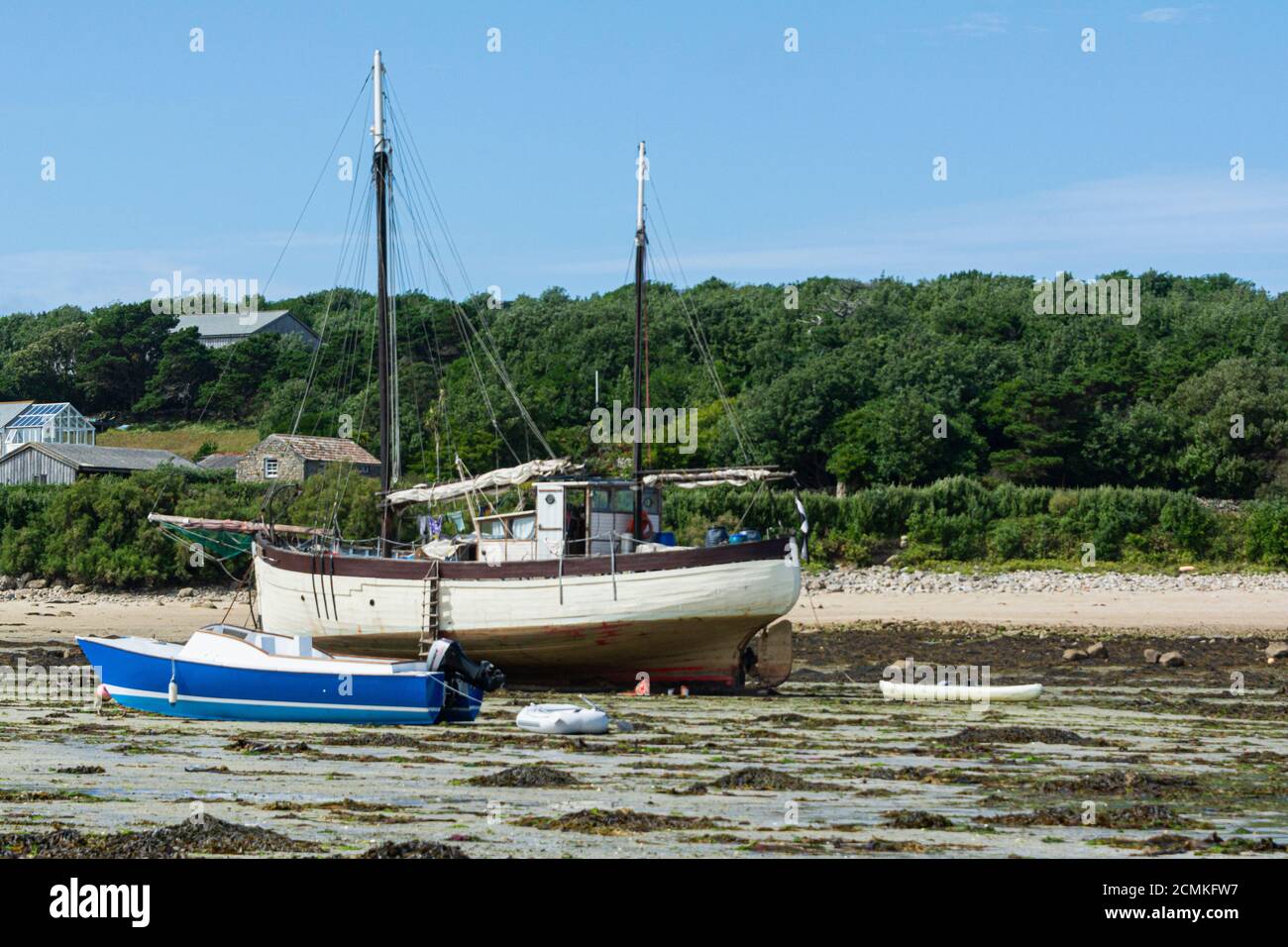 Boats stranded at extreme low tide in Green Bay, Bryher, Isles of ...