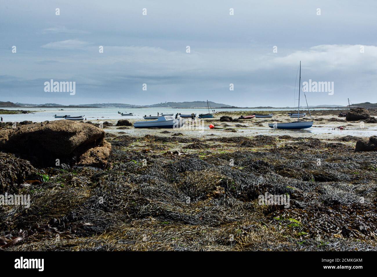 Boats stranded at extreme low tide in Green Bay, Bryher, Isles of ...