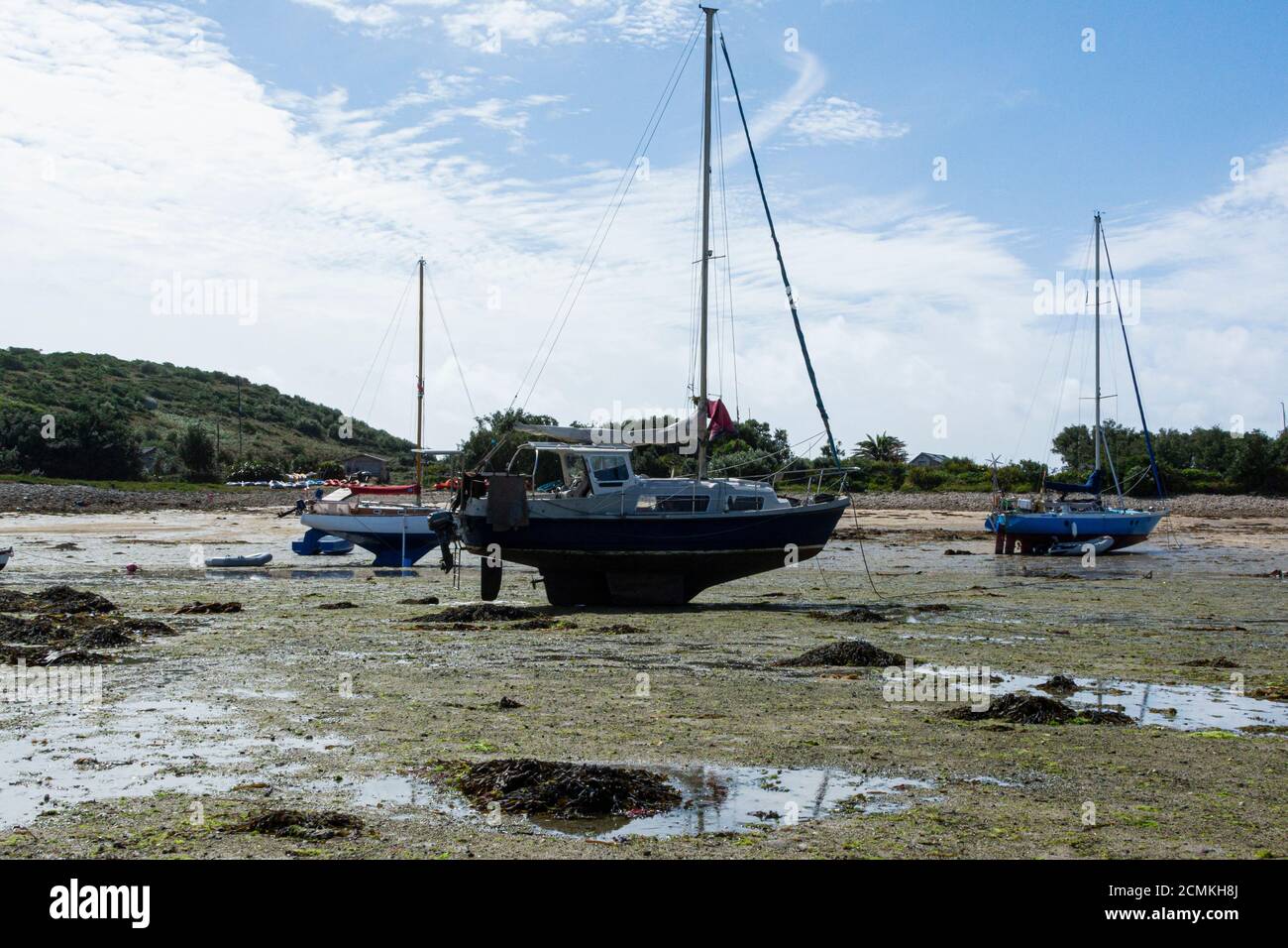 Boats stranded at extreme low tide in Green Bay, Bryher, Isles of ...