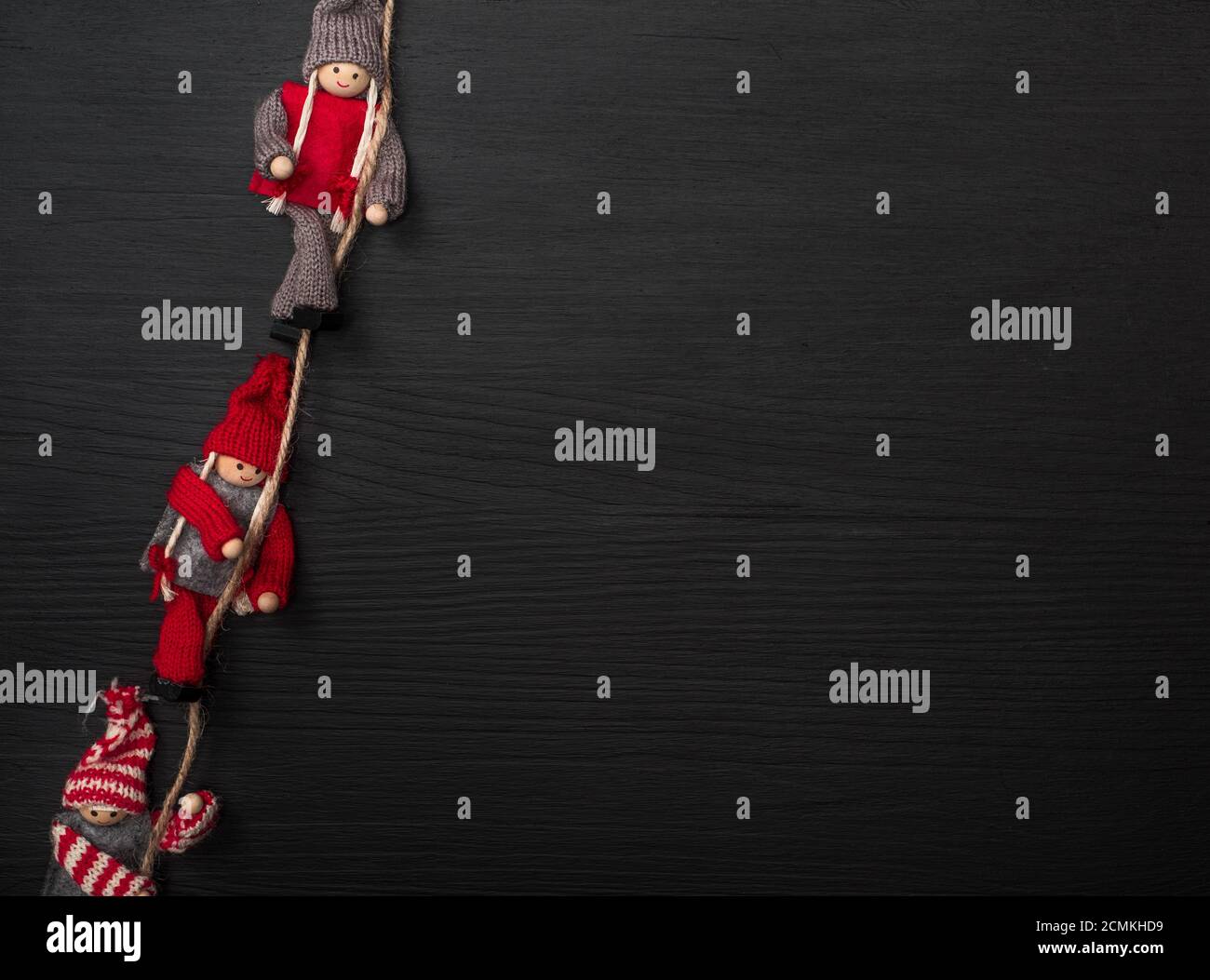 black wooden background with wooden puppets Stock Photo - Alamy