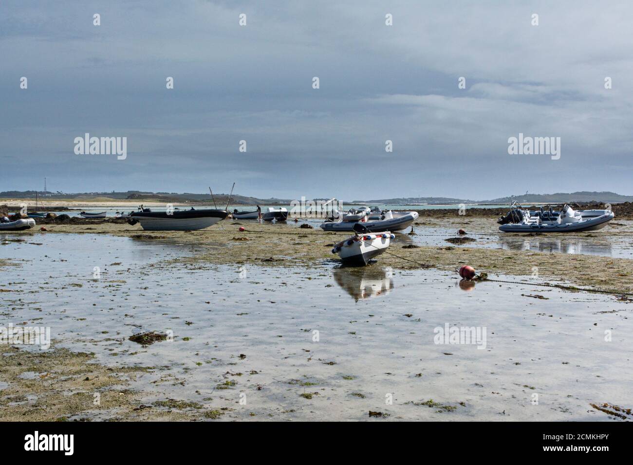 Boats stranded at extreme low tide in Green Bay, Bryher, Isles of ...