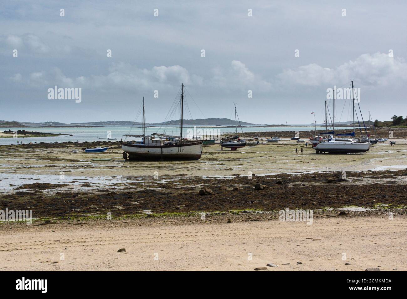 Boats stranded at extreme low tide in Green Bay, Bryher, Isles of ...