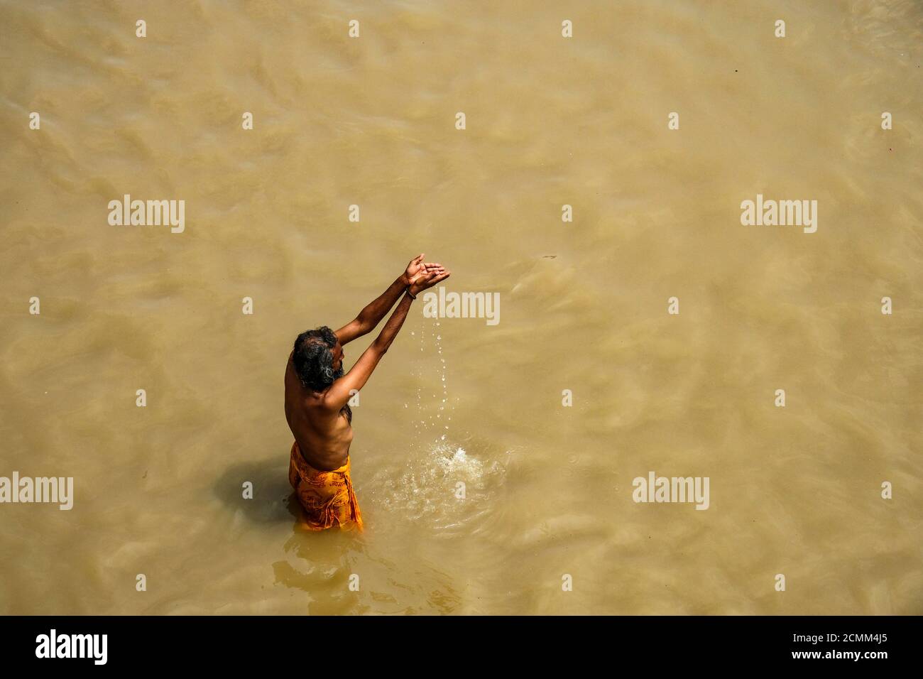 Varanasi, India - September 2020: A men making an offering on the ...