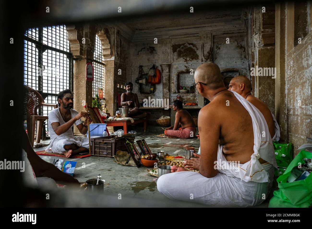 Varanasi, India - September 2020: Men receiving Hindu teachings at an ...