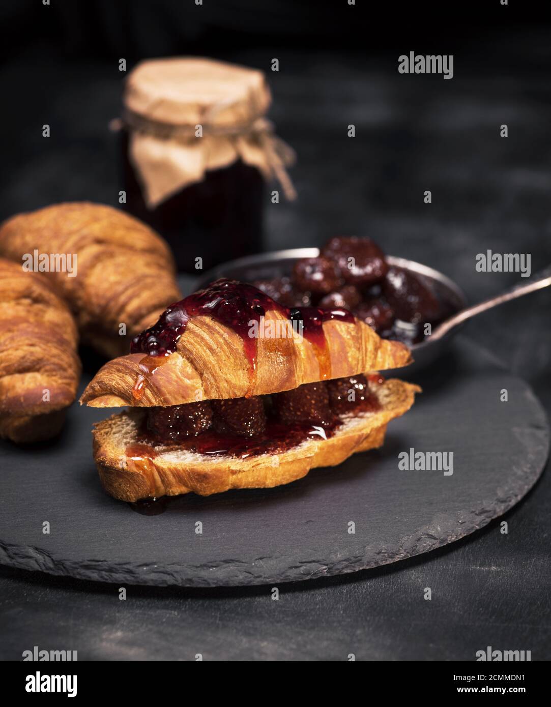 croissant with strawberry filling and jam Stock Photo - Alamy