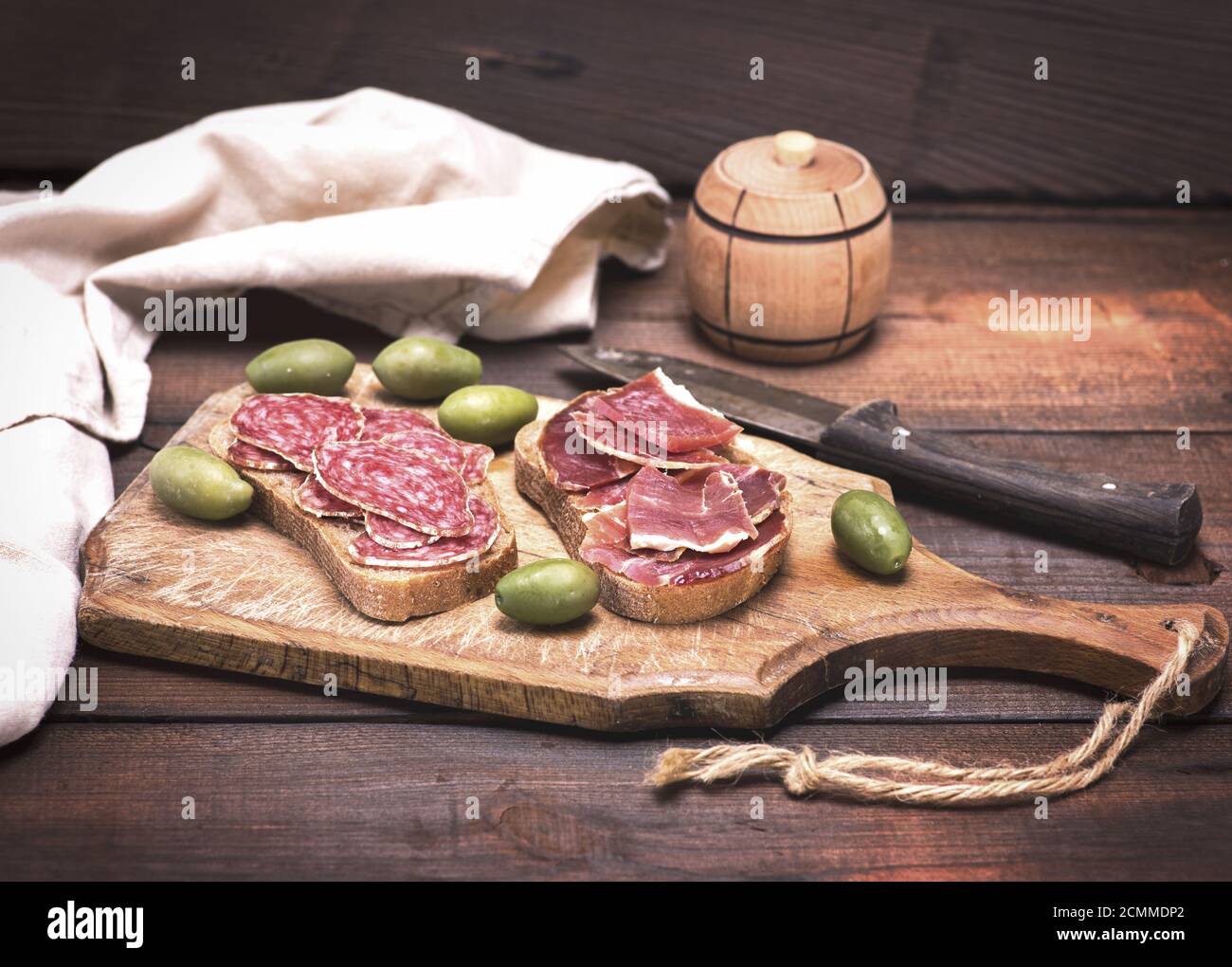sandwiches with smoked sausage salami and jamon Stock Photo - Alamy