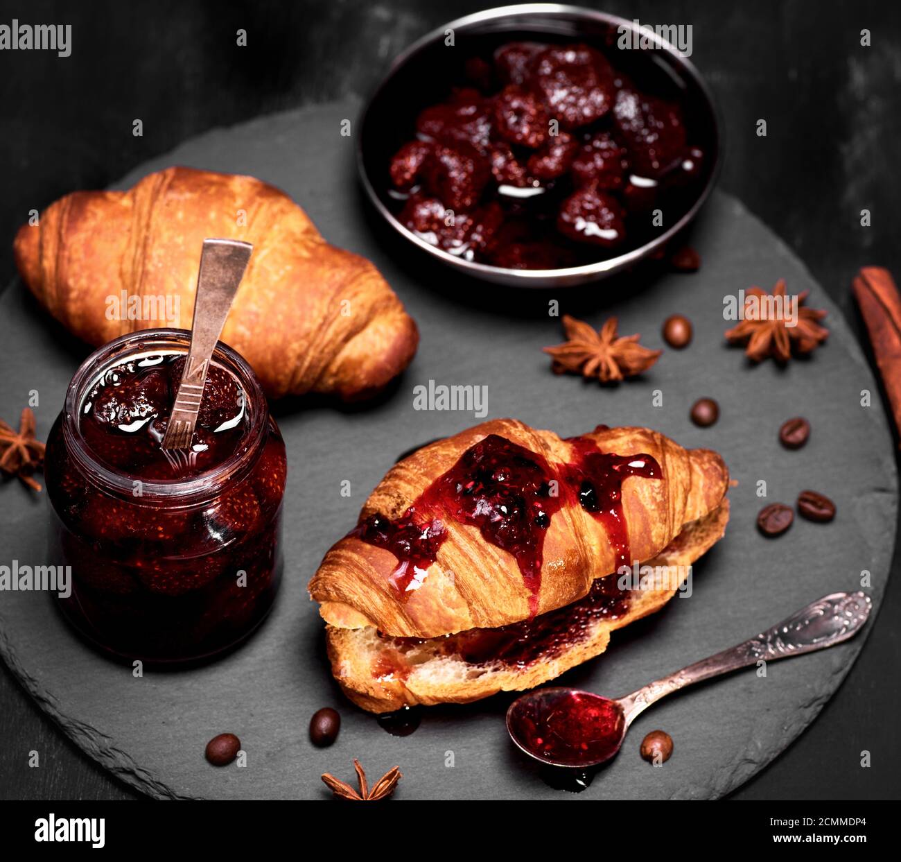 strawberry jam in a glass jar and baked croissant Stock Photo - Alamy