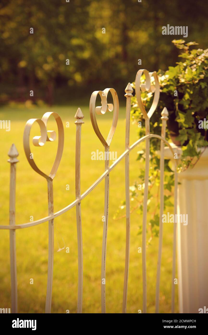 Heart-shaped fence design as a decoration at an outdoor wedding Stock ...