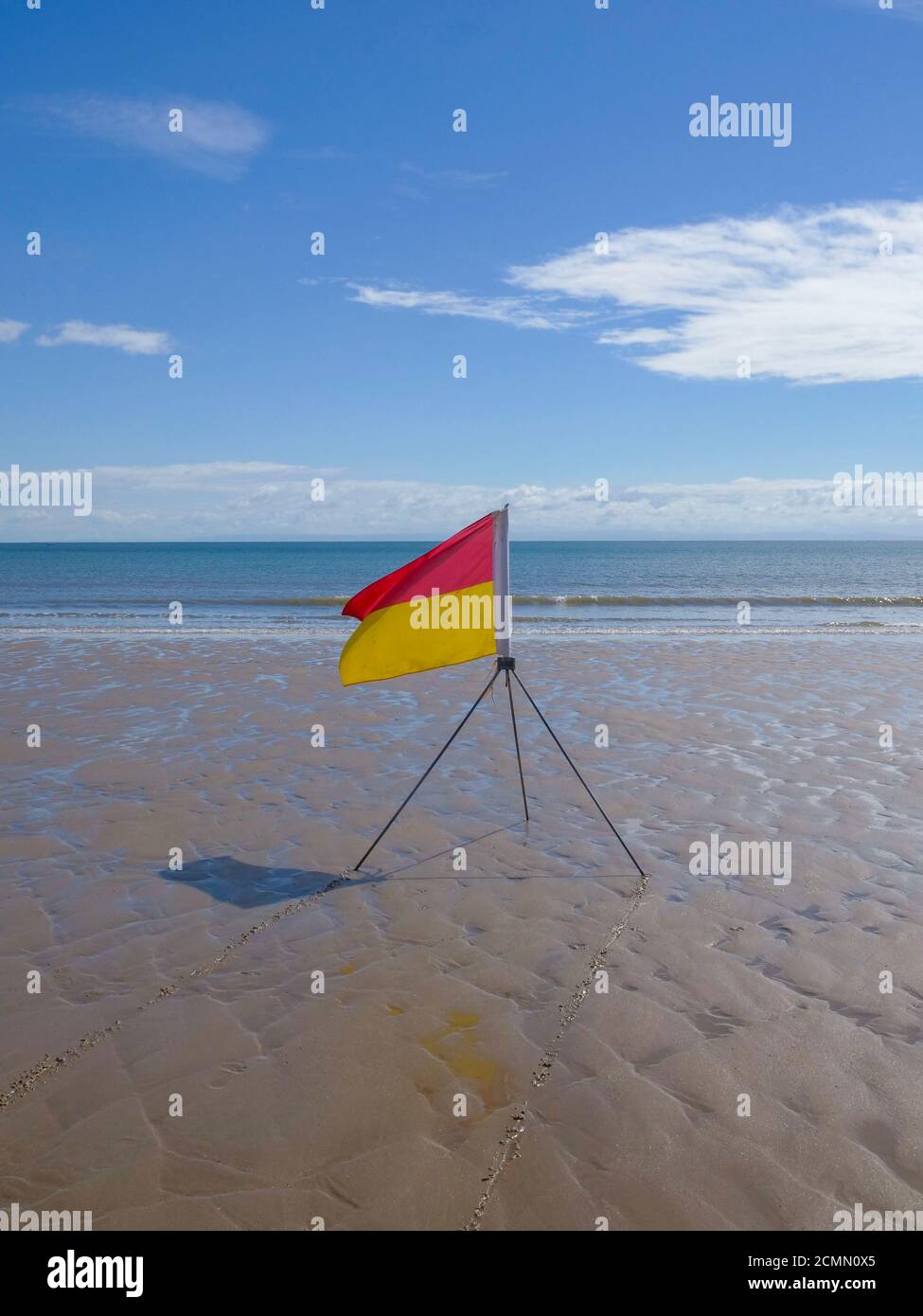 Lifeguard warniing flags on the beach at Port Eynon on the Gower ...