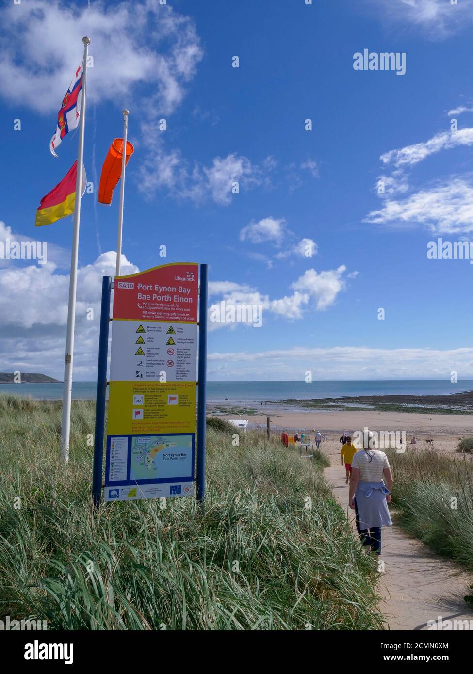 RNLI lifeguard signs and warning signs and flags on the beach at Port ...
