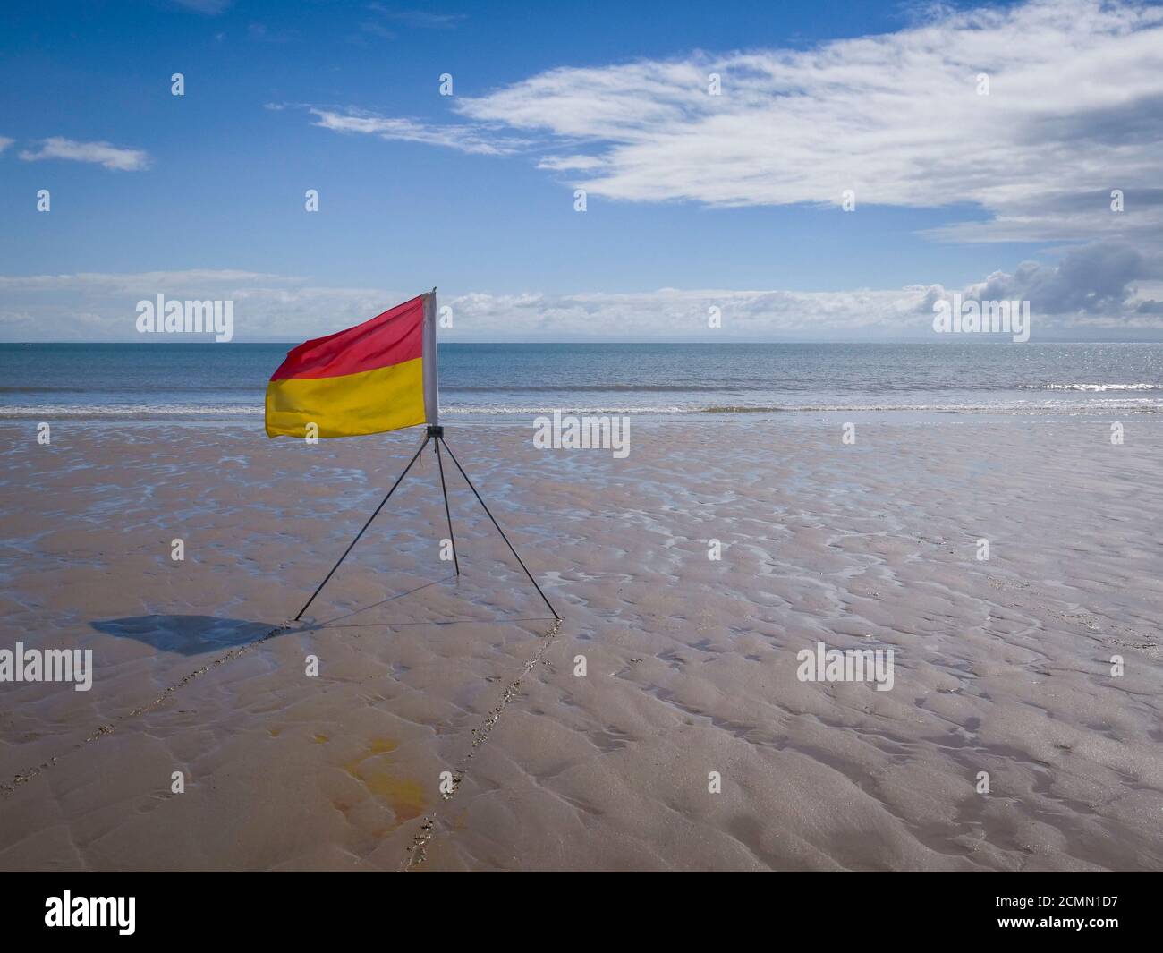 Lifeguard warniing flags on the beach at Port Eynon on the Gower ...