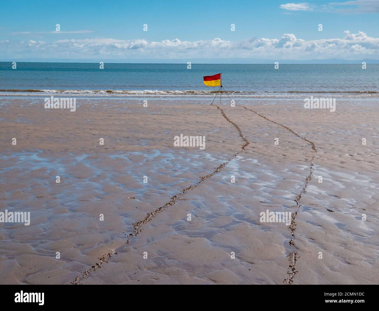 Lifeguard warniing flags on the beach at Port Eynon on the Gower ...