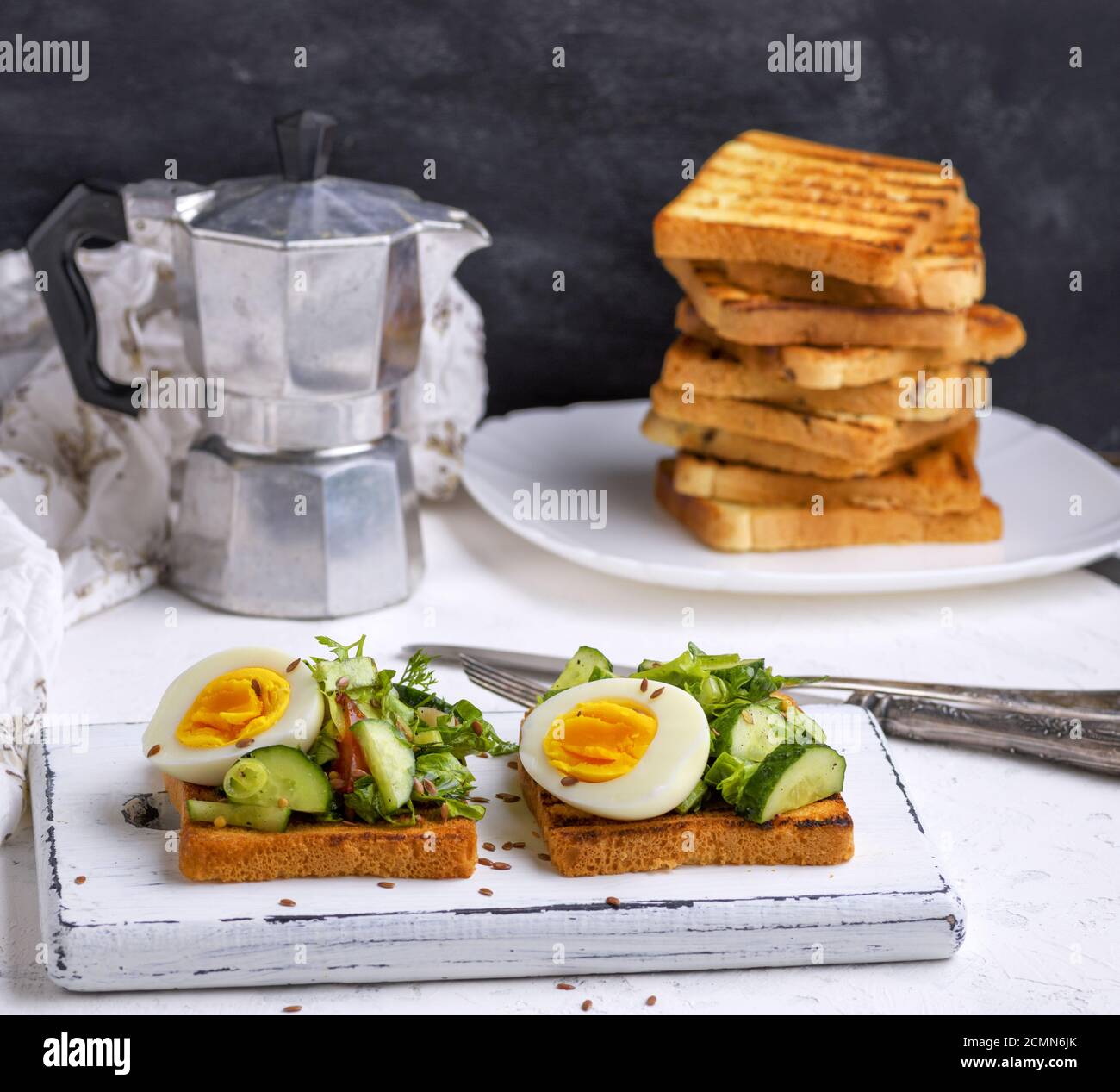 pieces of bread from white wheat flour with boiled egg Stock Photo - Alamy