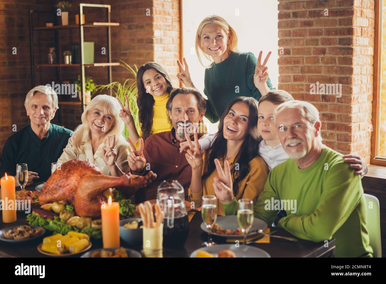 Portrait of full family eight people thanks giving party sit served ...