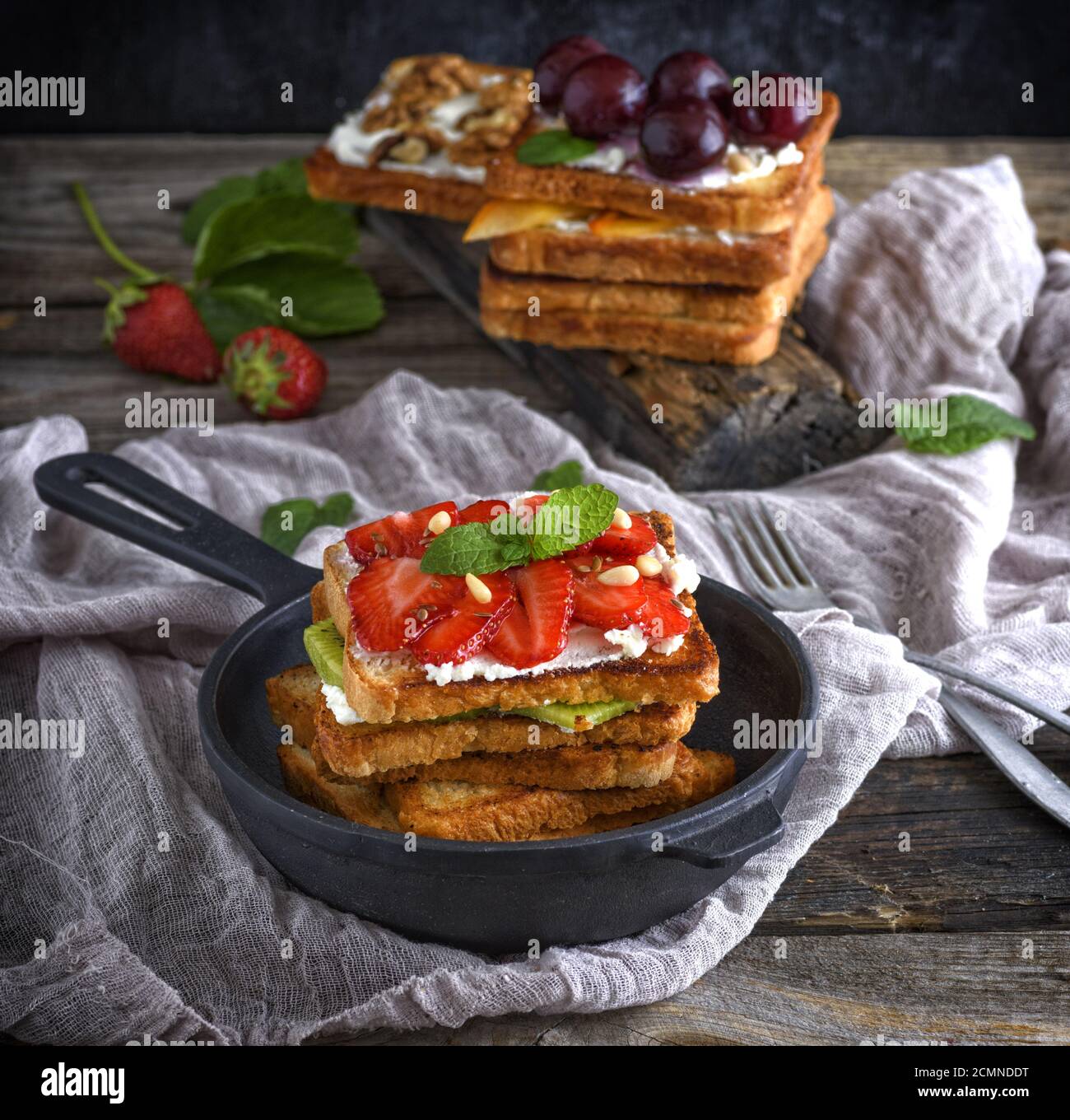 pile of French toast from white bread with cottage cheese in a black ...