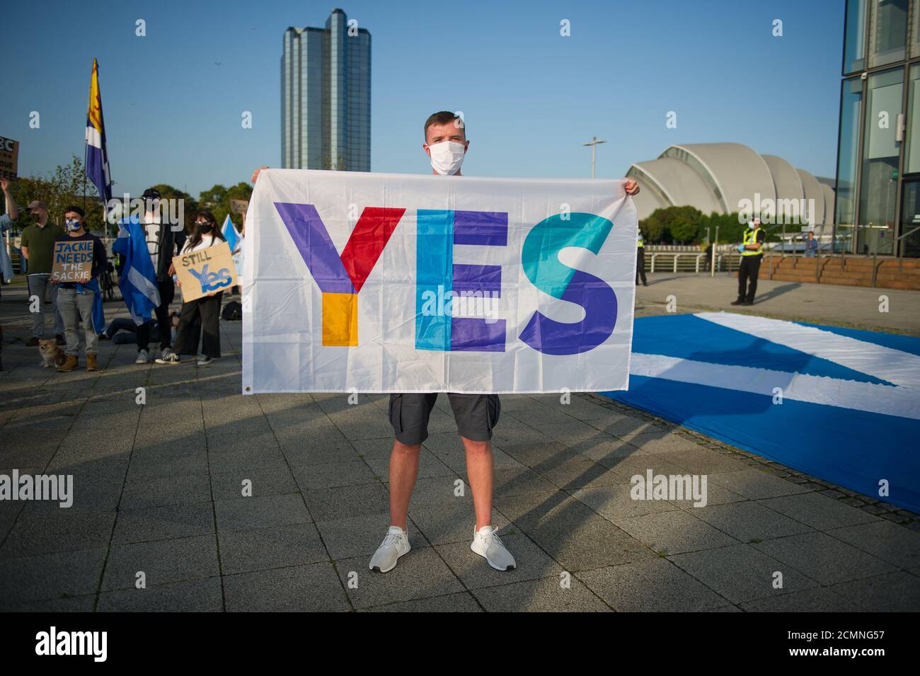 Man holding up large white yes flag banner flag hi-res stock ...