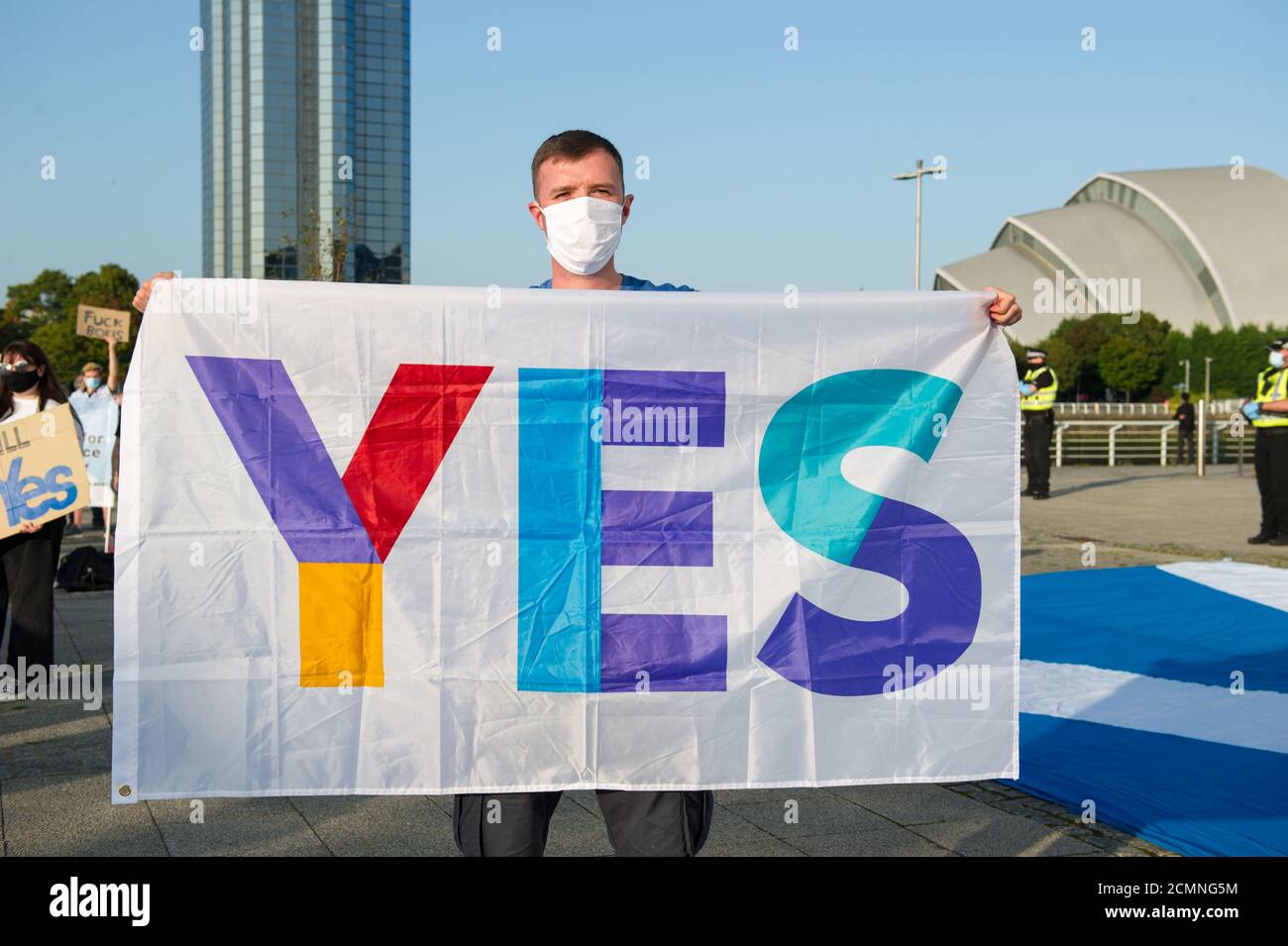 Man holding up large white yes flag banner flag hi-res stock ...