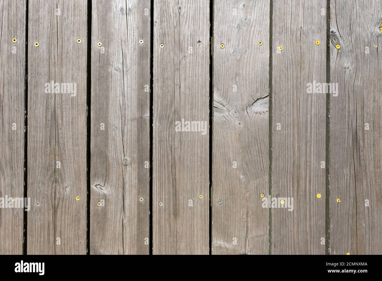 Corroded and damaged seasoned wooden floor plank with scratch marks ...