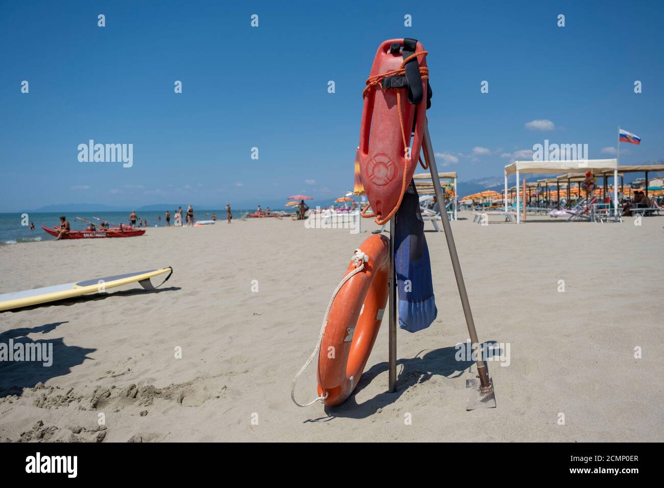 Life preserver on sandy beach somewhere in Italy Stock Photo - Alamy