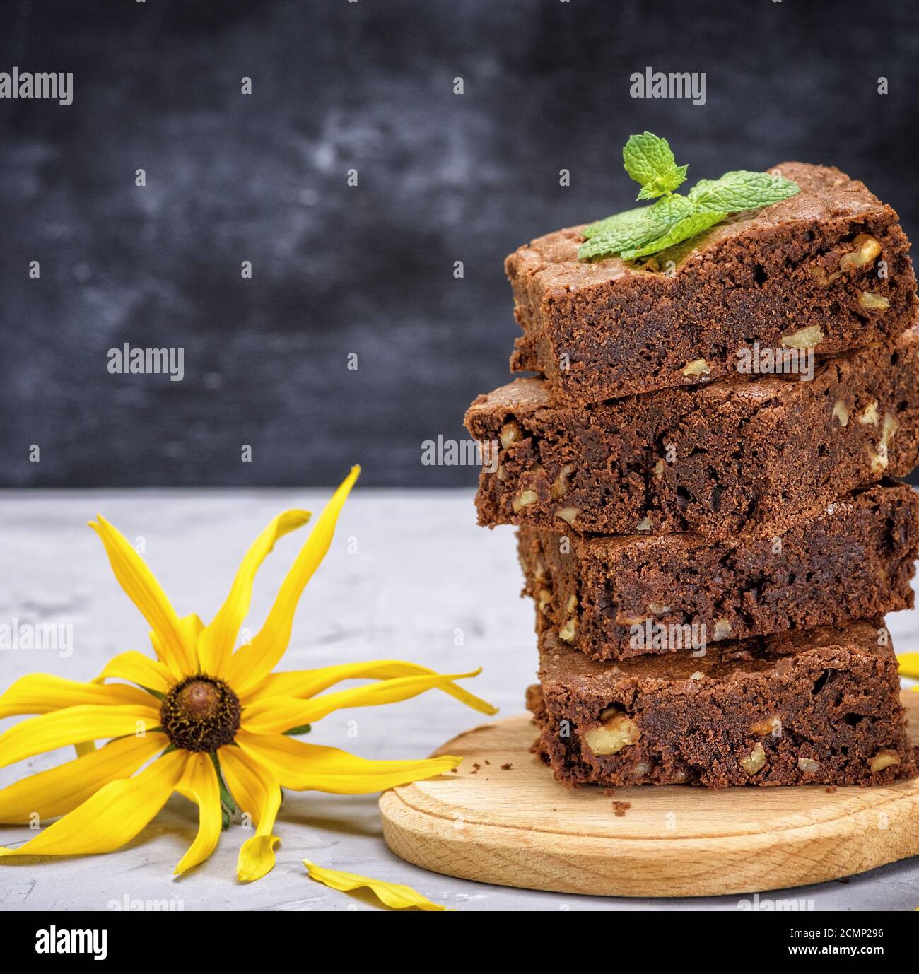 stack of baked square pieces of brownie pie Stock Photo - Alamy