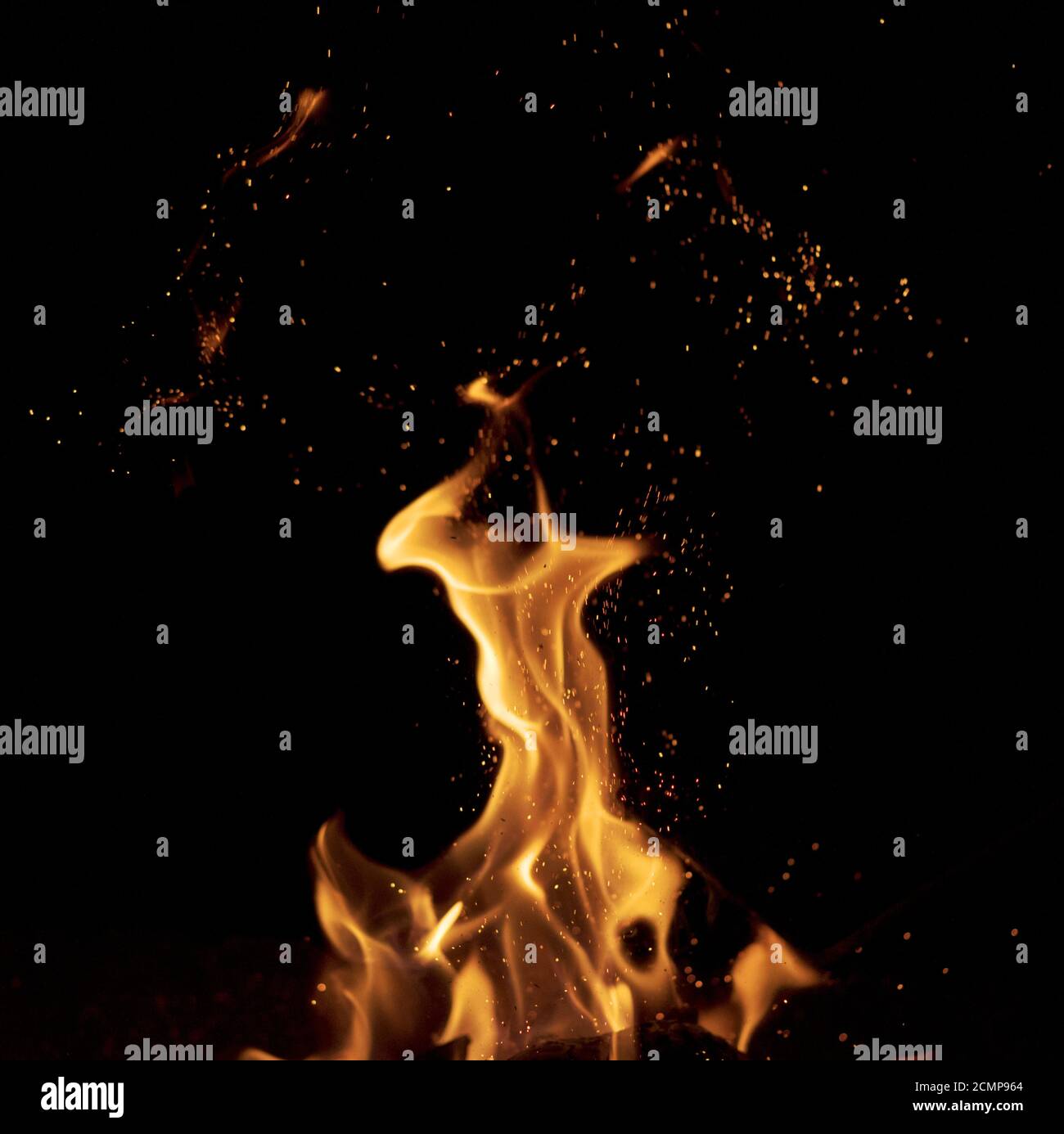 bright orange and yellow flames with sparks Stock Photo - Alamy