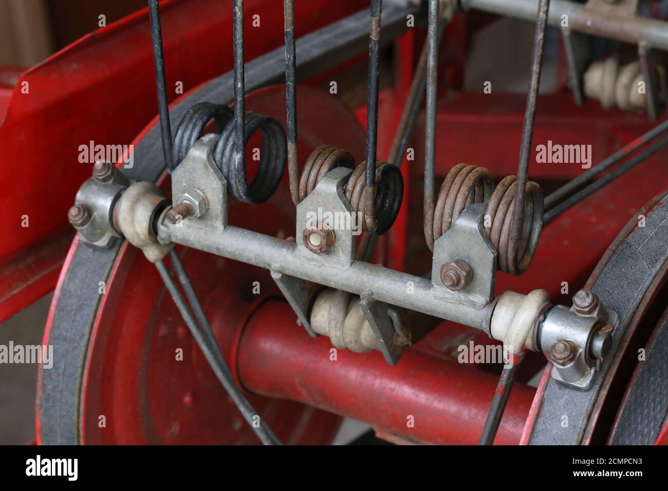 Closeup of rusty metal mechanisms in a red machine Stock Photo - Alamy
