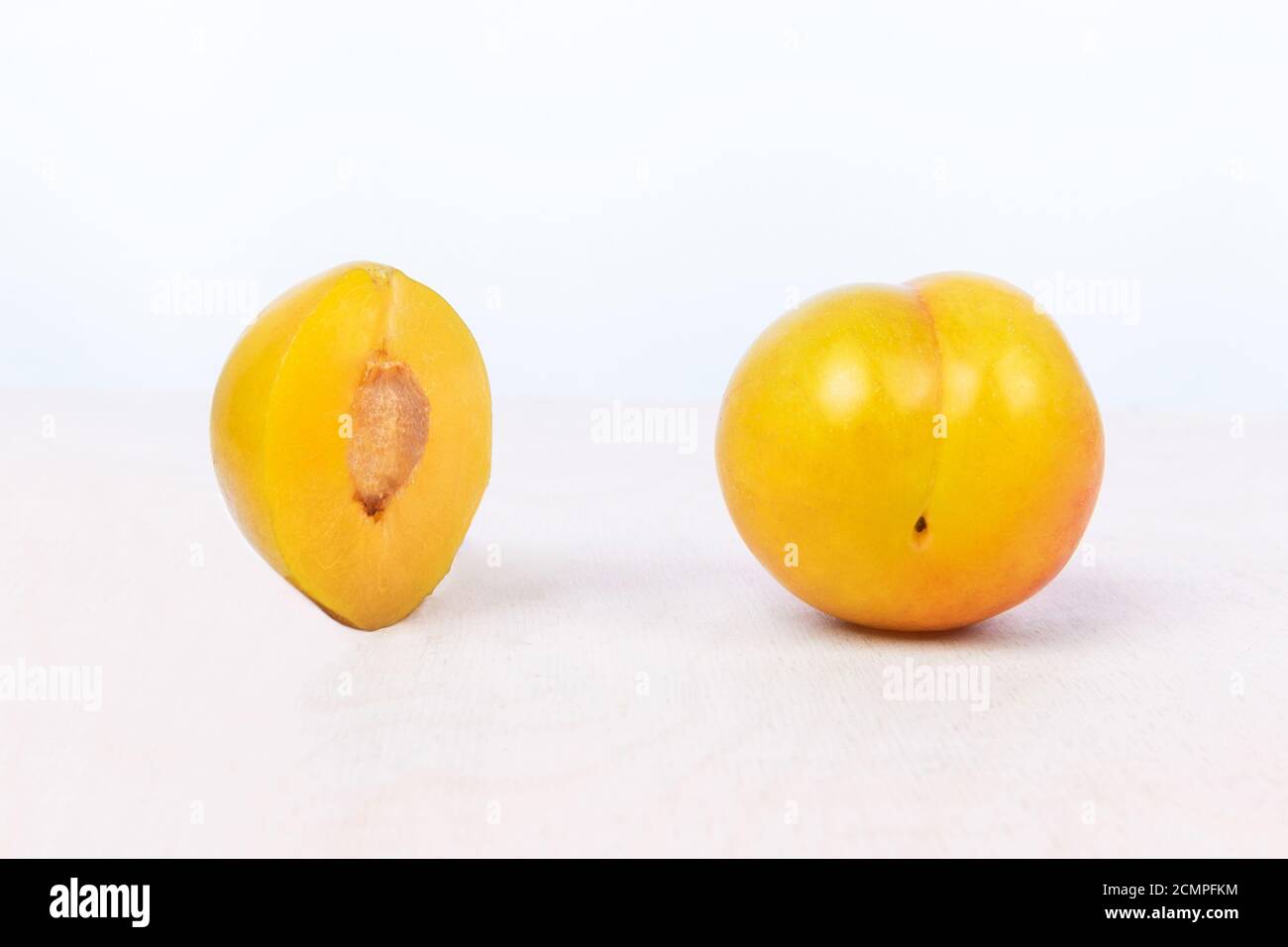 Yellow plum fruit on the white background isolated Stock Photo - Alamy