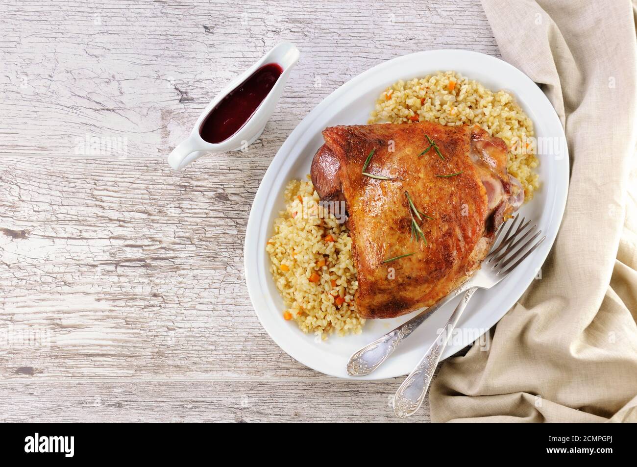 Baked turkey thigh with garnish bulgur and vegetables Stock Photo - Alamy