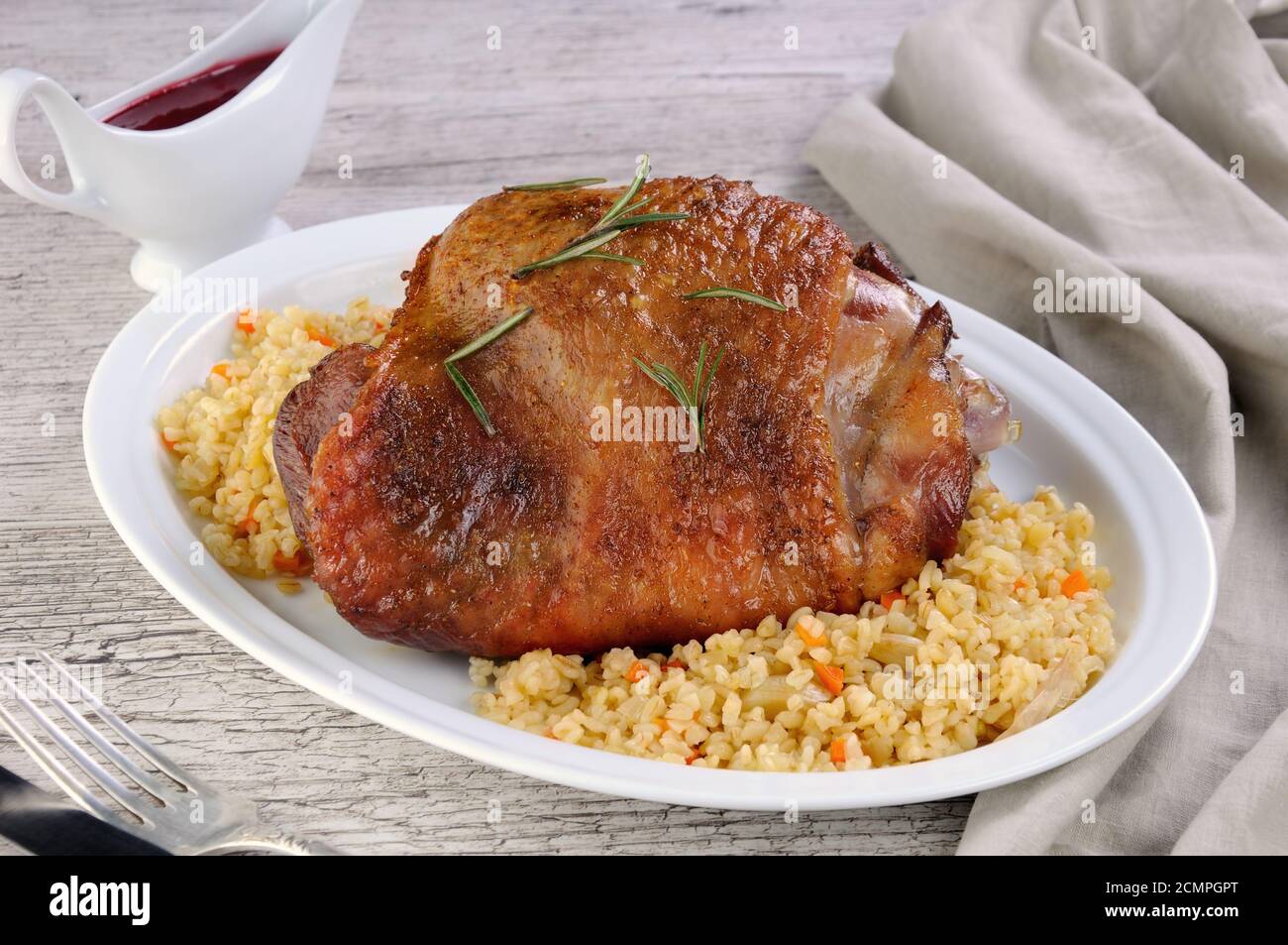 Baked turkey thigh with garnish bulgur and vegetables Stock Photo - Alamy