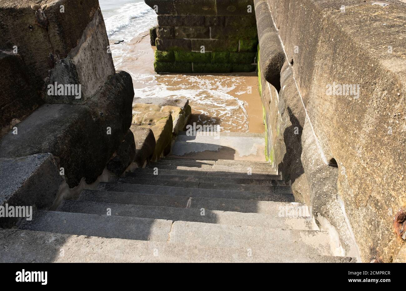 Old stone steps leading down to a beach Stock Photo - Alamy