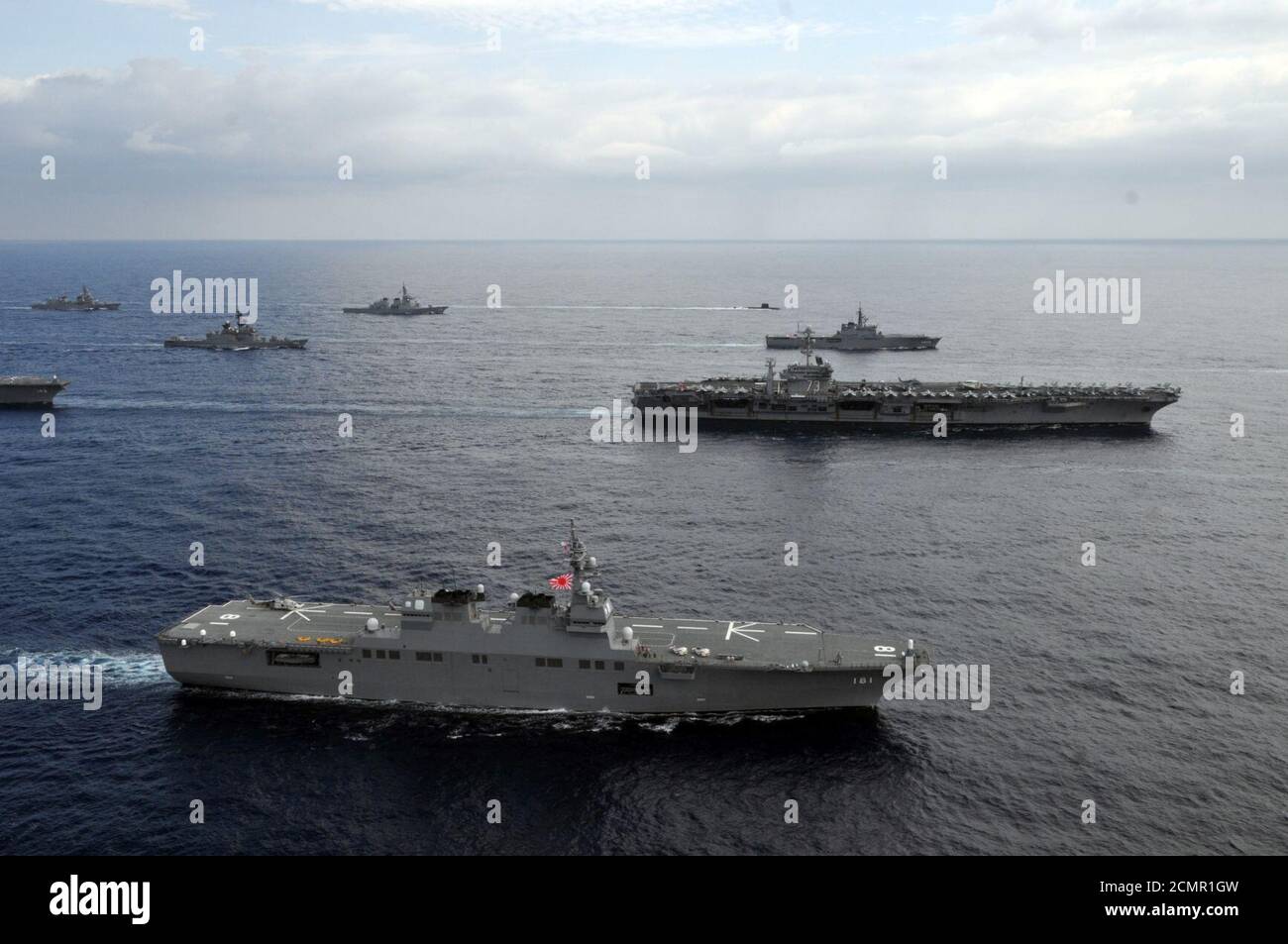 JS Hyūga (DDH-181) in formation with USS George Washington in the East ...