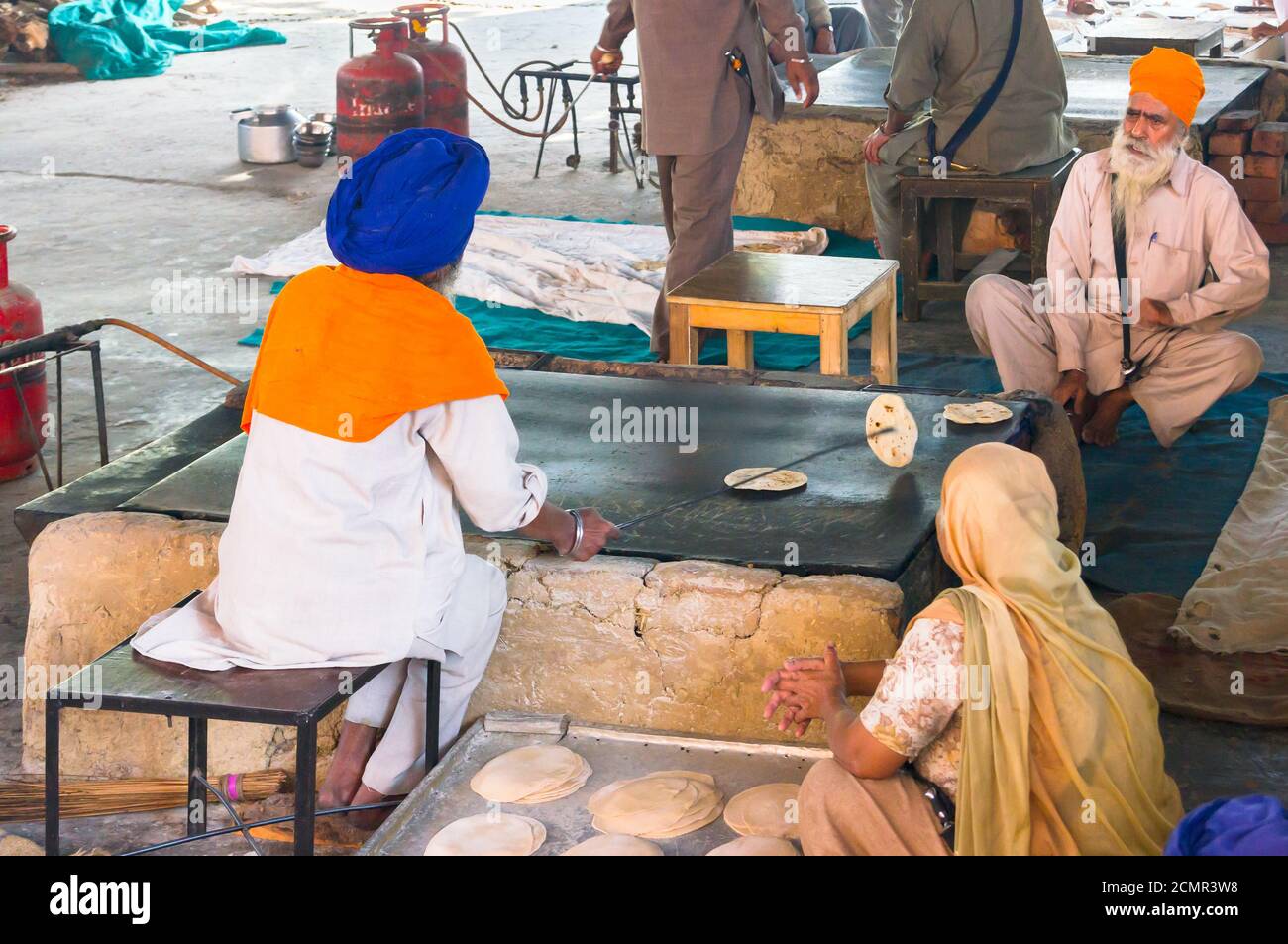 Amritsar, India - November 21, 2011: Unknown Indian people cook ...