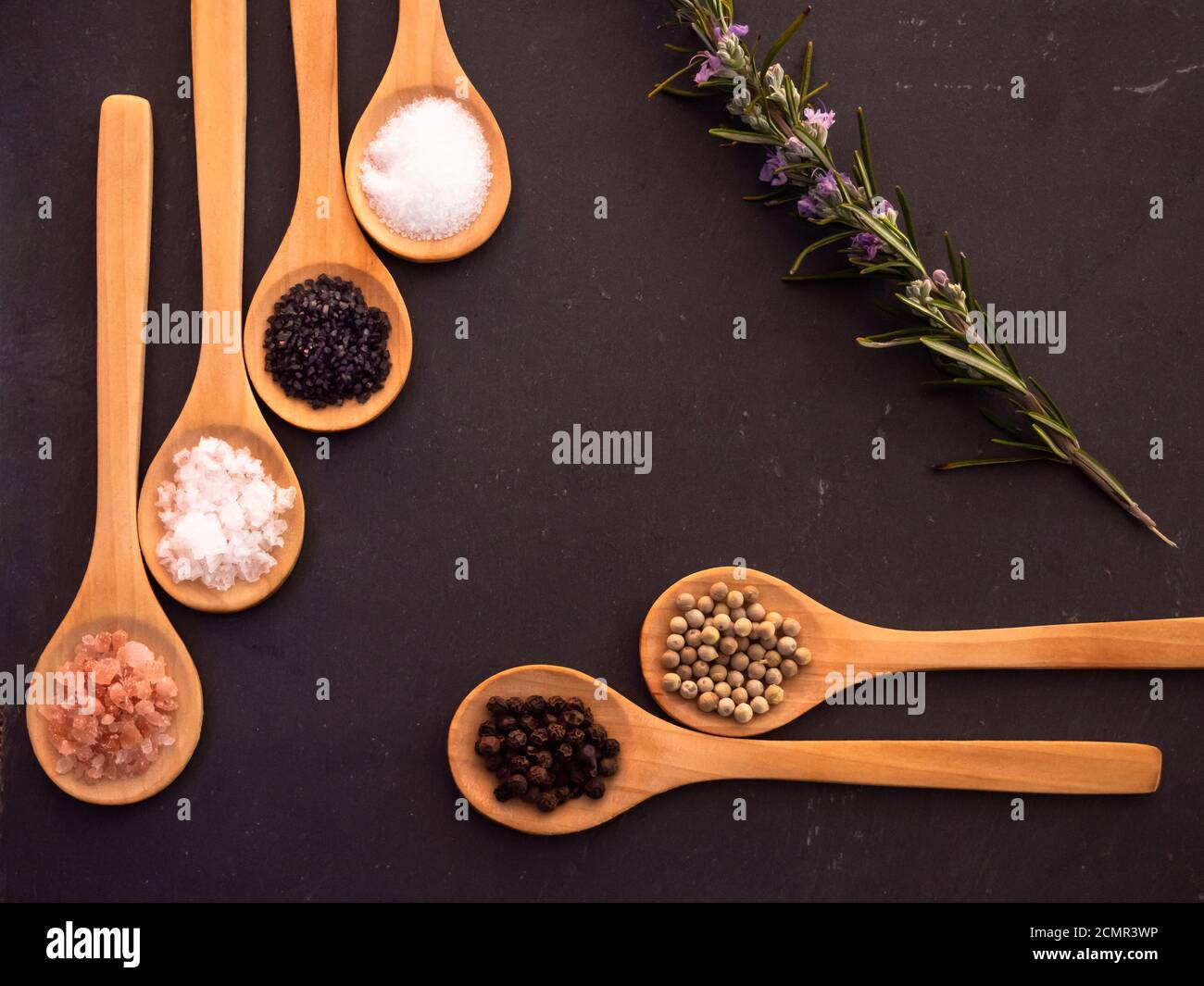 Wooden spoons with himalayan salt, black hawaii salt, common salt, salt ...