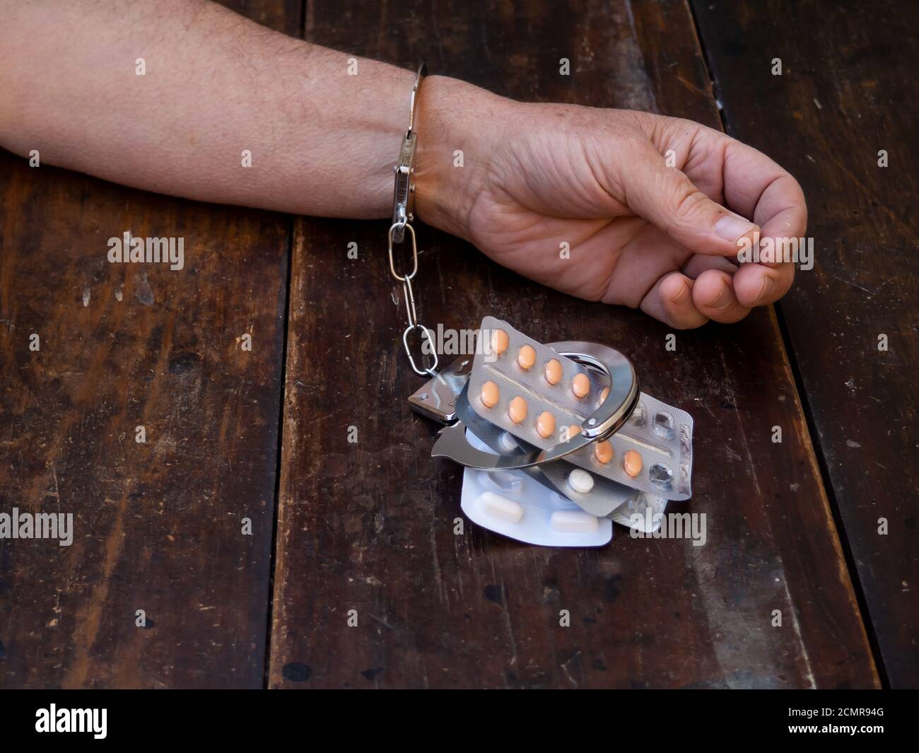 Handcuffed Arm High Resolution Stock Photography and Images - Alamy