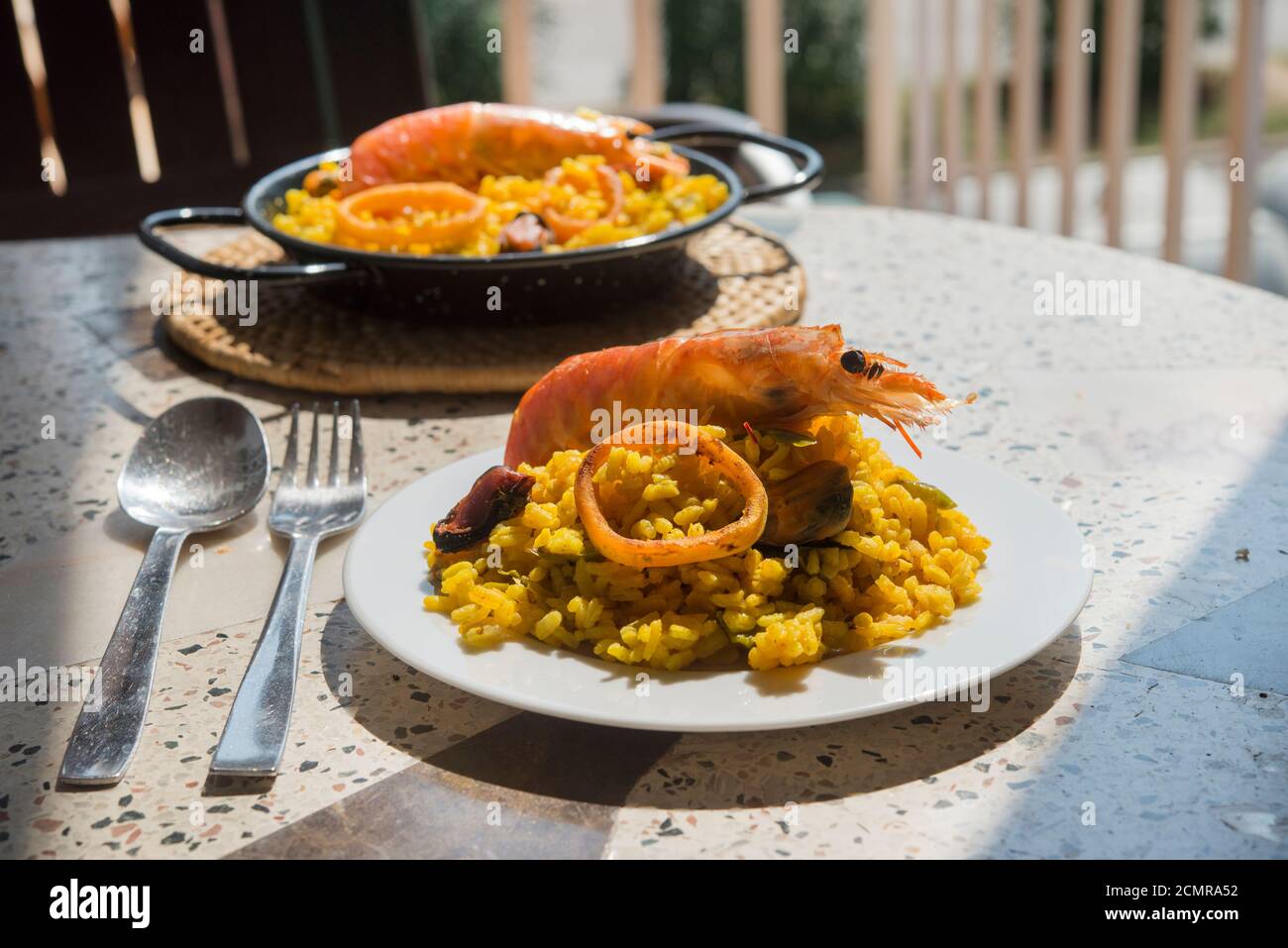 Paella typical spanish food in granite background Stock Photo - Alamy