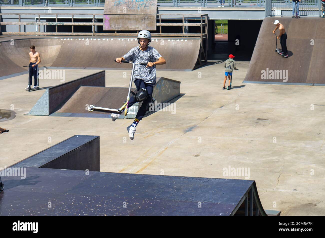 stunt scooters, young people in a skate Park, scooter sport, freestyle ...