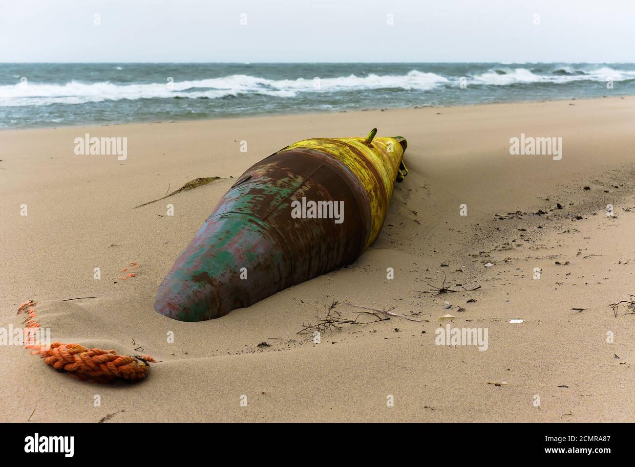 old iron float on the shore, sea buoy made of iron Stock Photo - Alamy