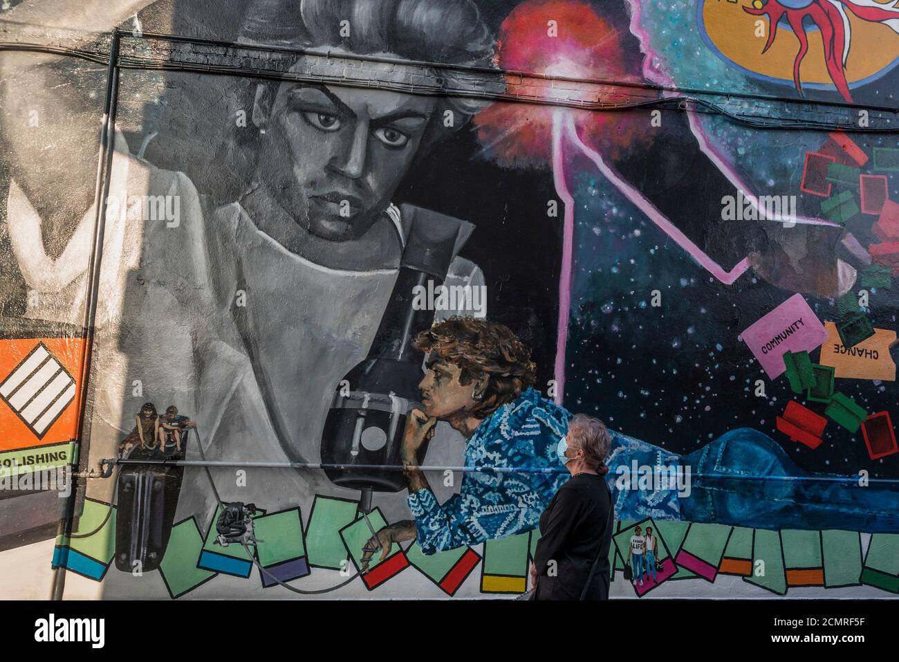 London, UK. 17 September 2020. A passer-by views a 9m tall mural of the ...