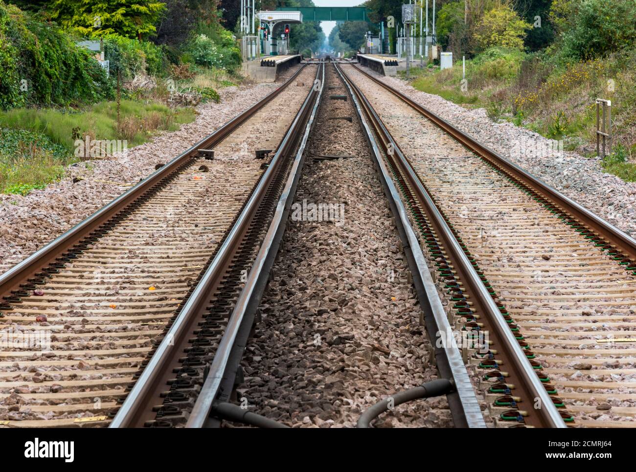two railway lines or tracks in the countryside tapering away into the ...
